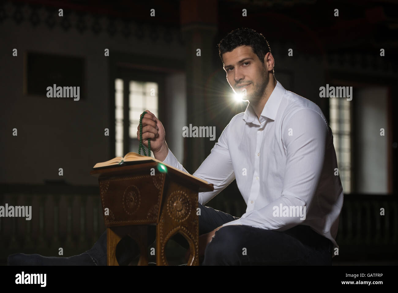 Humble Muslim Man Is Reading The Koran In The Mosque Stock Photo - Alamy