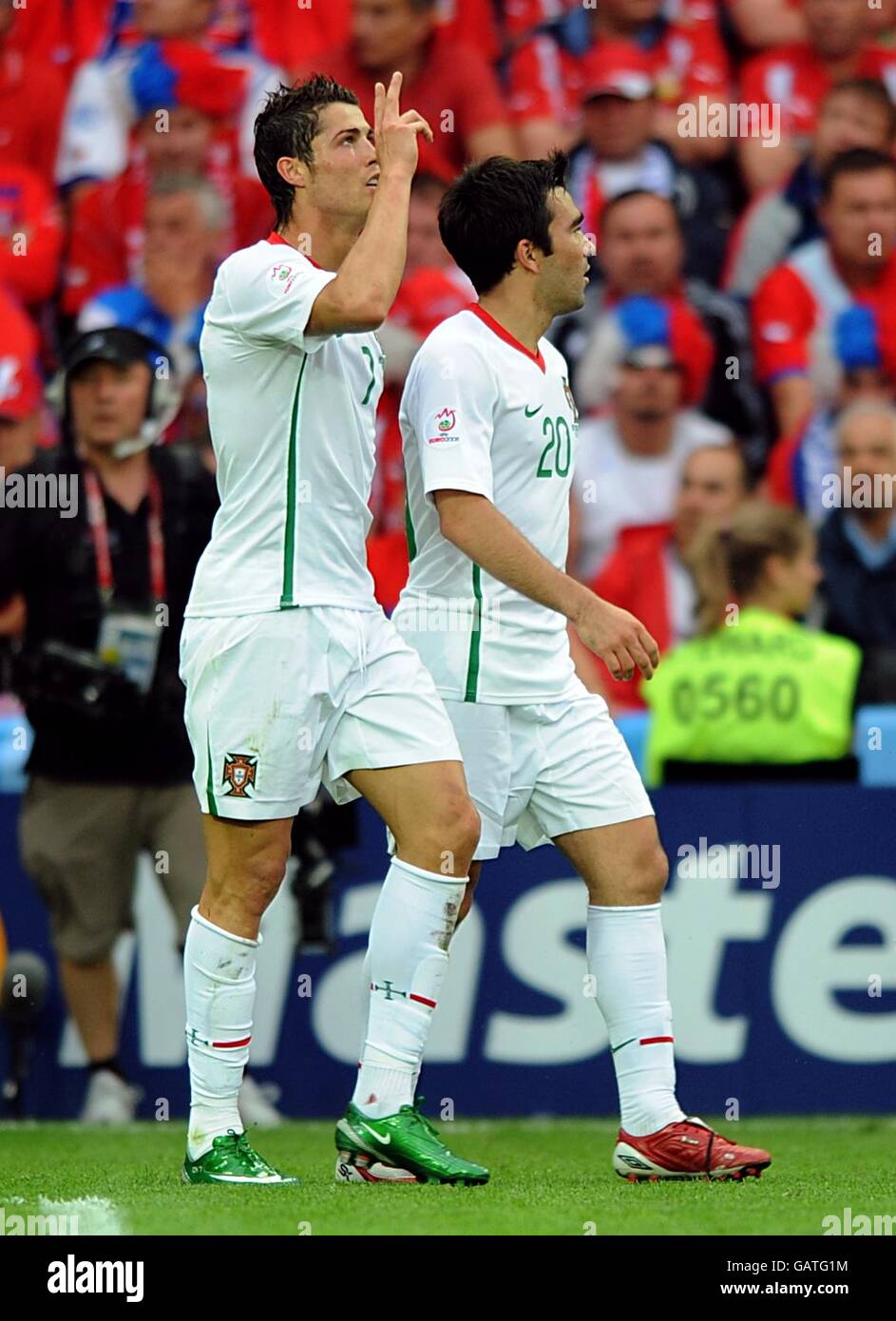 Portugal's Cristiano Ronaldo (left) celebrates with team mate Anderson ...