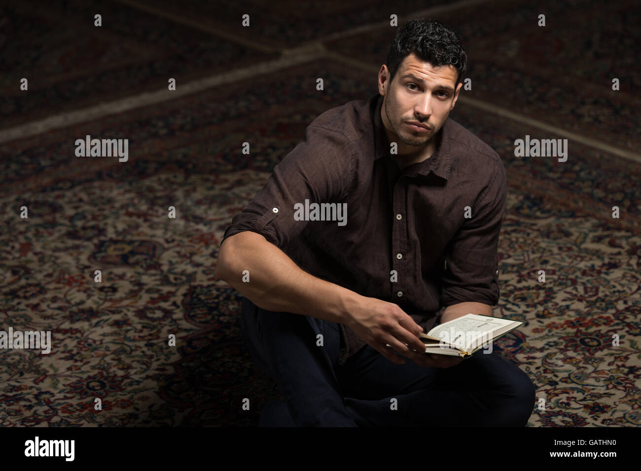 Adult Muslim Man Is Reading The Koran In The Mosque Stock Photo - Alamy