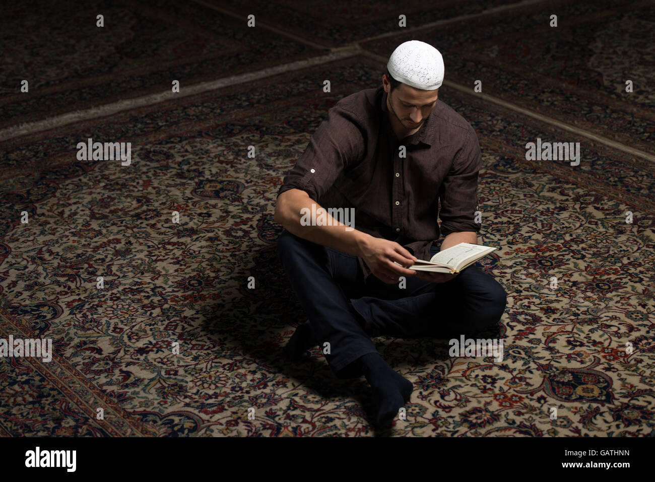 Adult Muslim Man Is Reading The Koran In The Mosque Stock Photo - Alamy