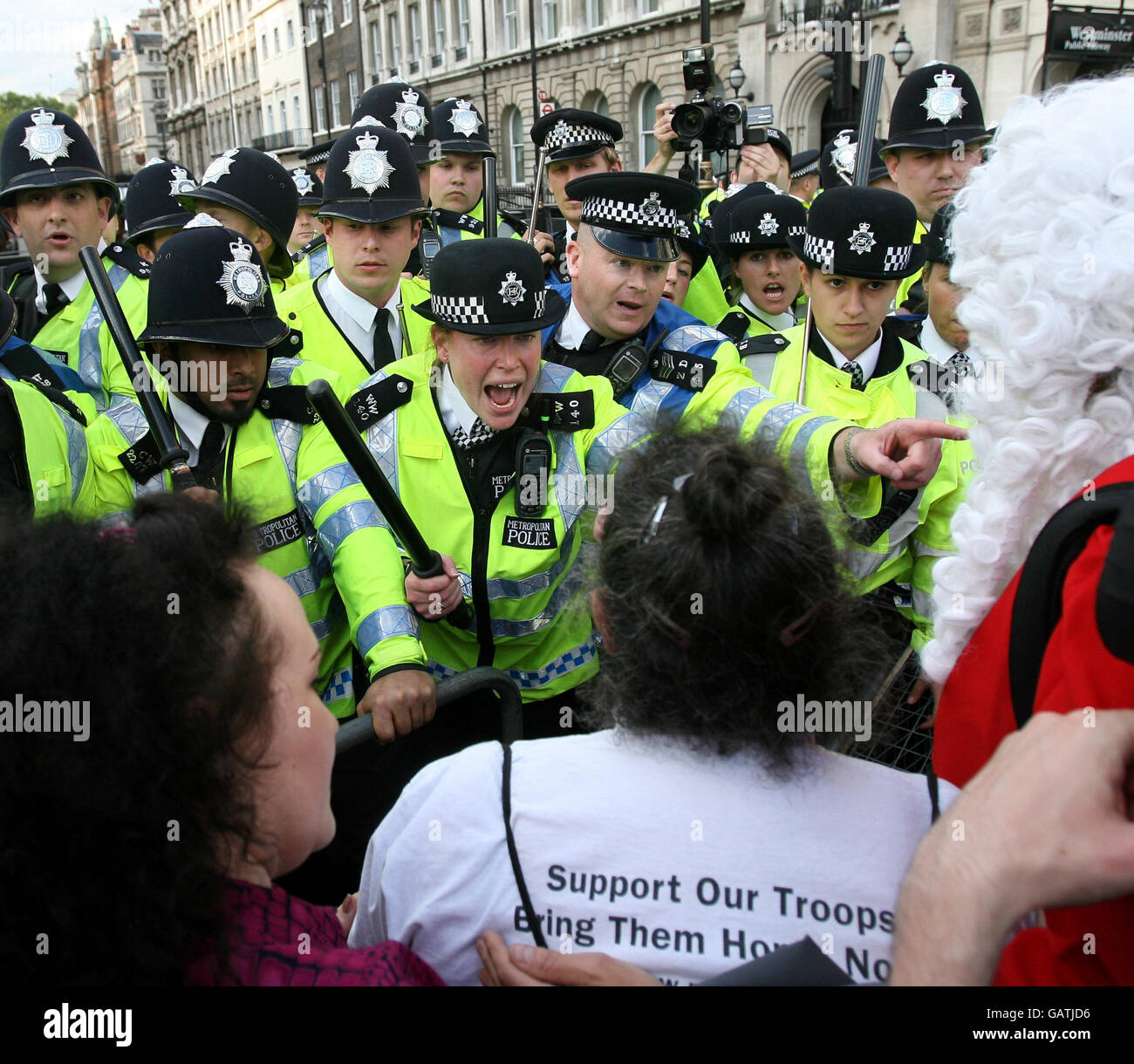 A stand-off takes place between police and anti-war protesters during a ...