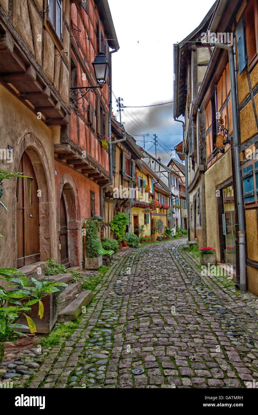 Street with half-timbered medieval houses in Eguisheim Stock Photo - Alamy