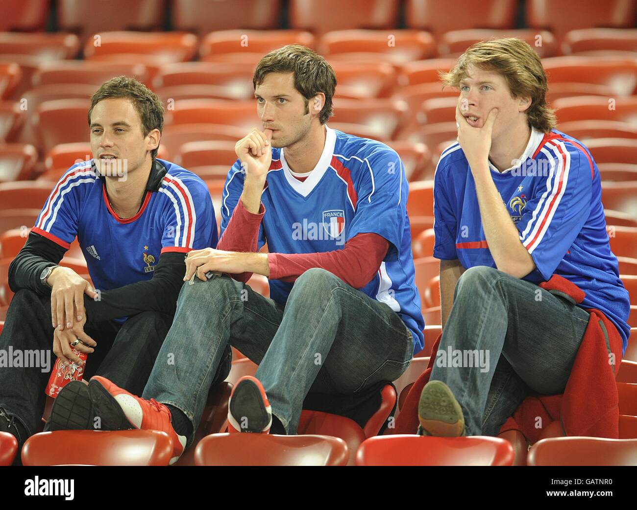 French fans are left dejected after the final whistle as they crash out ...