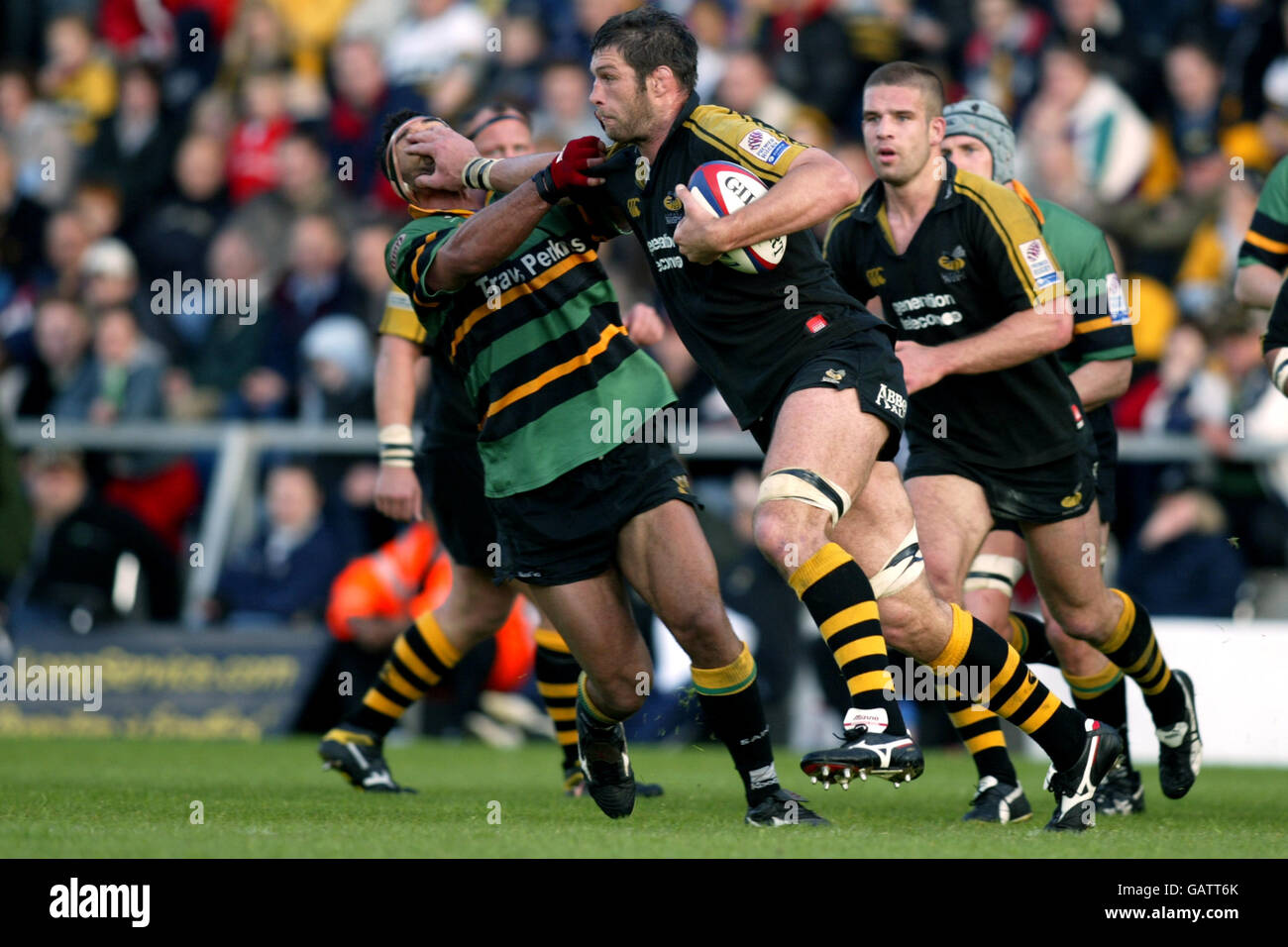 London Wasps' Simon Shaw palms off Northampton Saints' Andrew Blowers ...