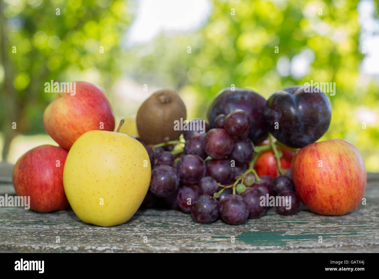 fruits in wooden table, outdoor, in the garden Stock Photo - Alamy