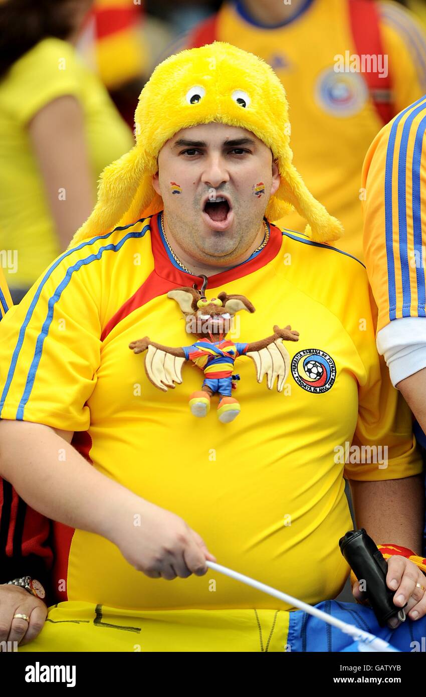 A Romanian fan soaks up the atmosphere prior to kick off Stock Photo ...