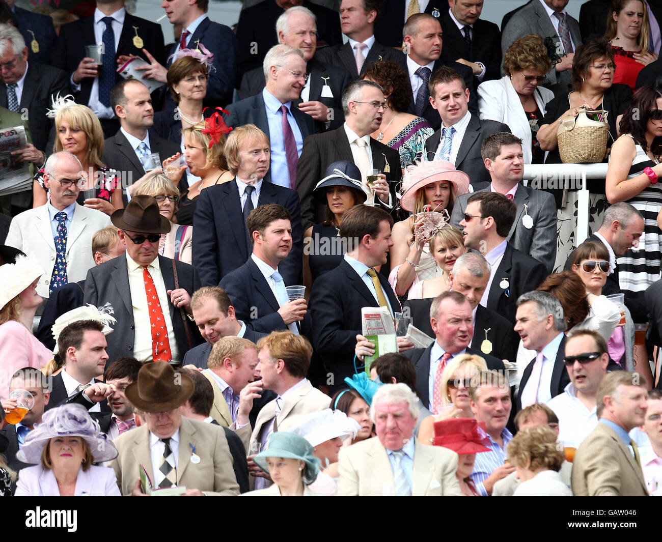 The crowd in the stands watch the day's racing at Epsom Downs ...