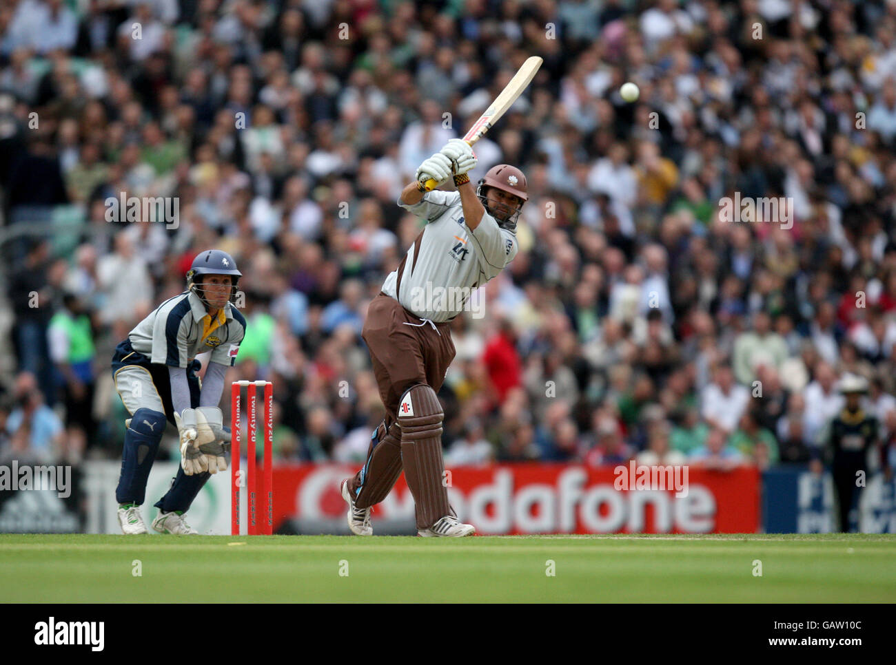 Surrey Brown Caps' Scott Newman hits out on his way to 48 Stock Photo ...