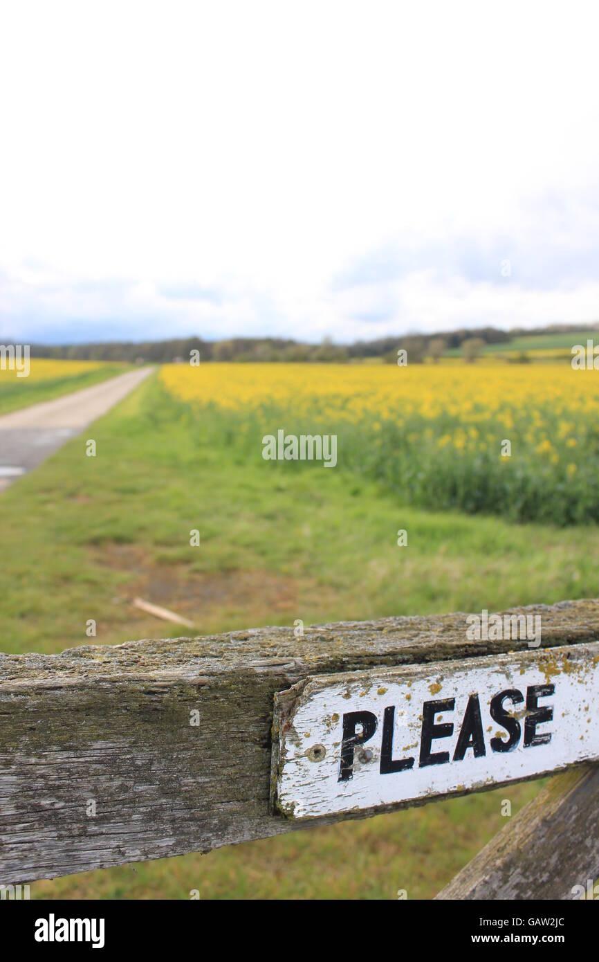 Please sign on gate in field Stock Photo - Alamy