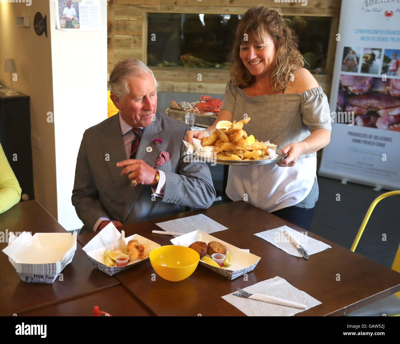 The Prince of Wales at a fish and chip shop in the village of Aberdaron ...