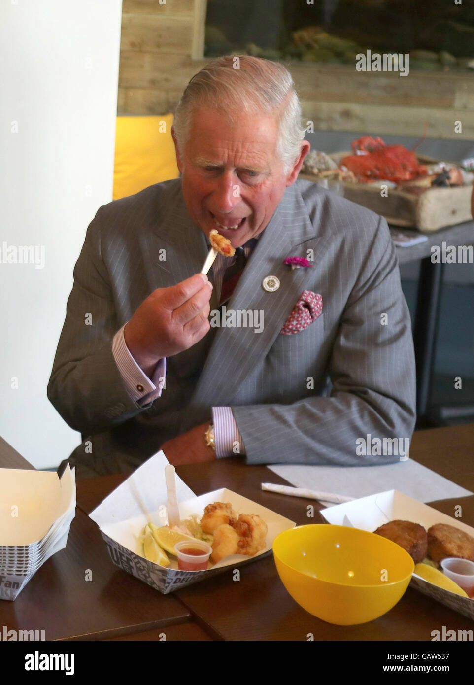 The Prince of Wales at a fish and chip shop in the village of Aberdaron ...