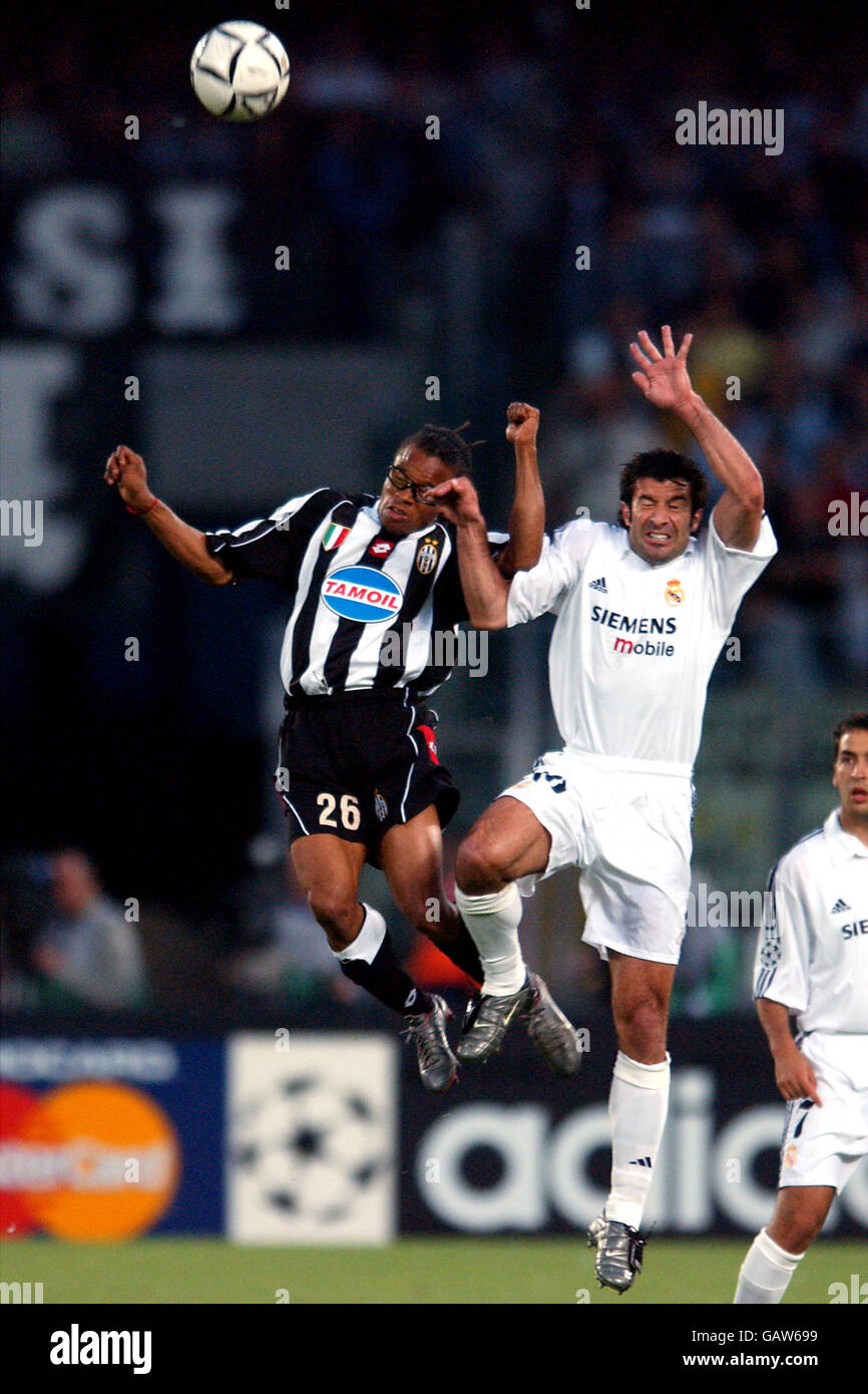 (L-R) Juventus' Edgar Davids and Real Madrid's Luis Figo bothe jump for ...