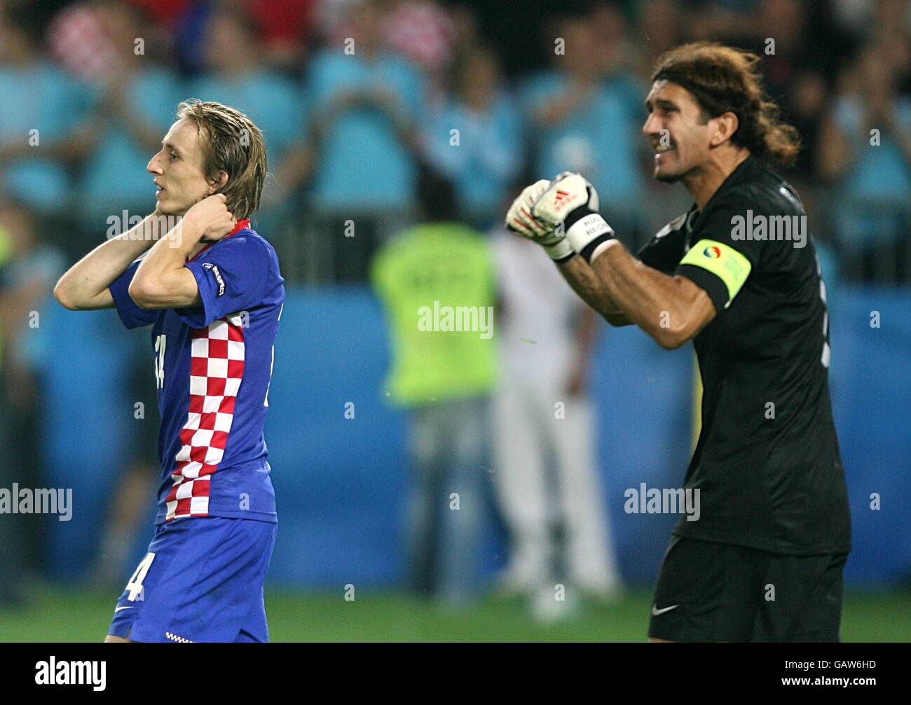 Turkey goalkeeper Recber Rustu (r) celebrates after Croatia's Luka ...