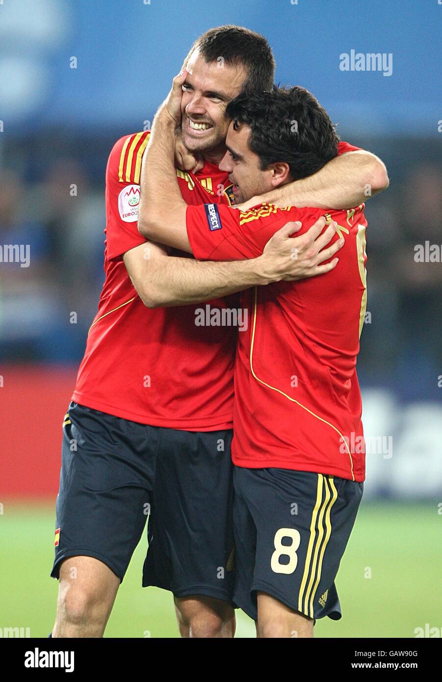 Spain's Carlos Marchena and Xavi celebrate after team mate Francesc ...