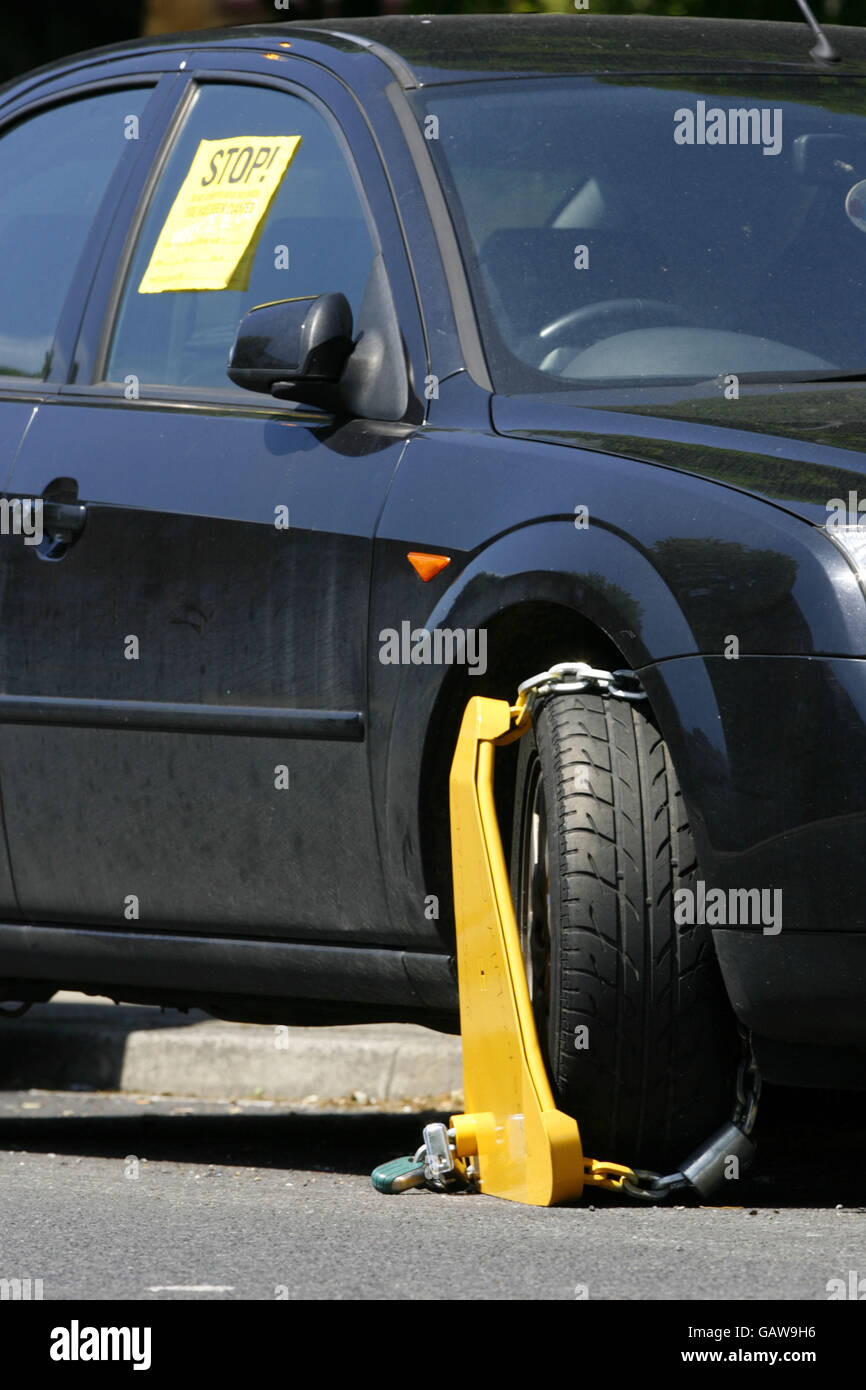 Stock image car incapacitated by wheel clamp hi-res stock photography ...