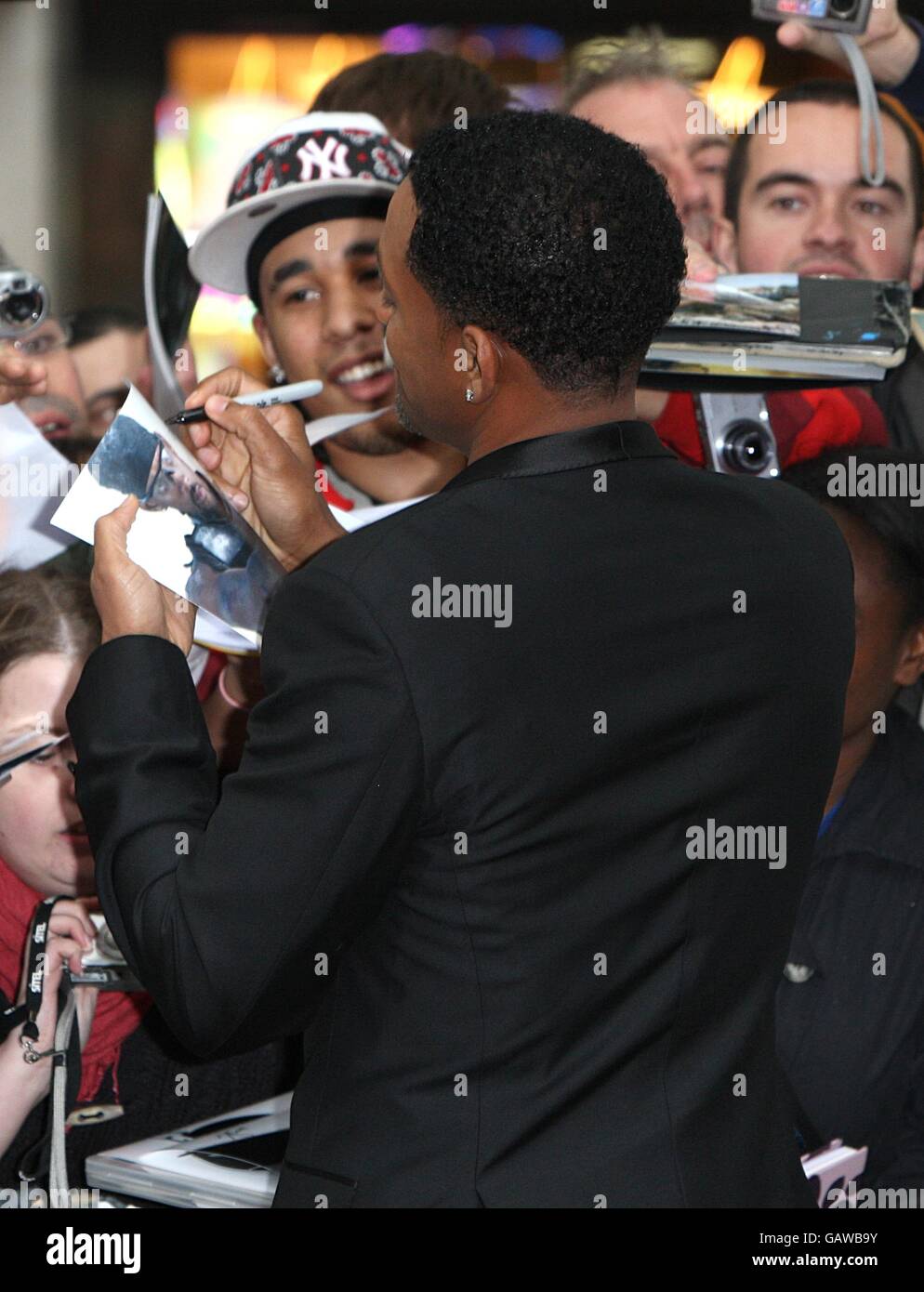 Will Smith signs autographs for fans as he arrives for the UK Film ...