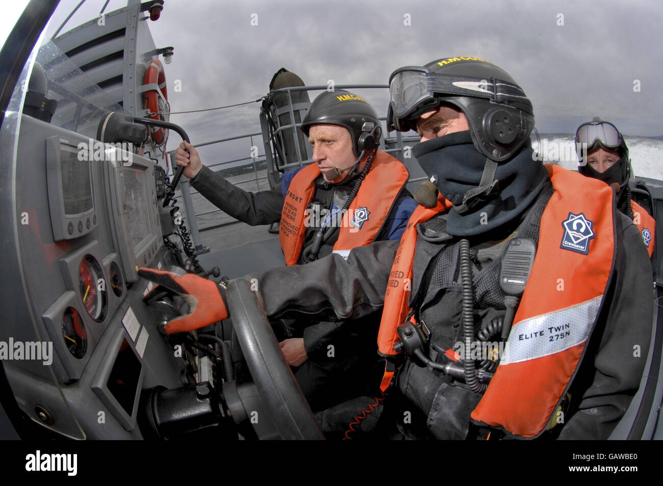 Maritime enforcement officer Shaun Edwards (left) prepares to launch ...