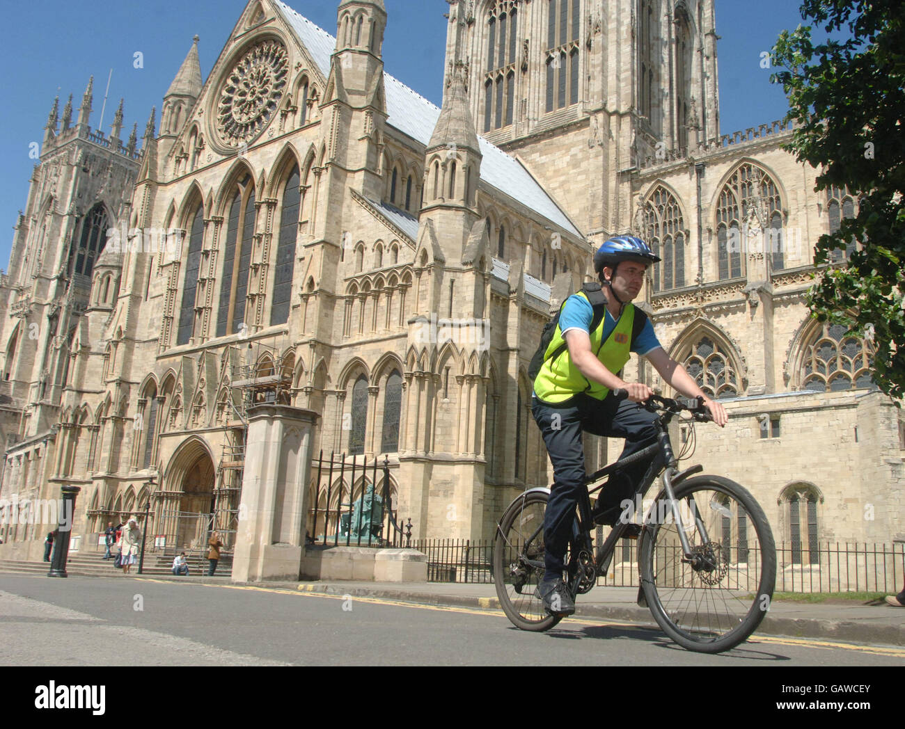 A cyclist uses the cycle path next to York Minster in York city centre ...
