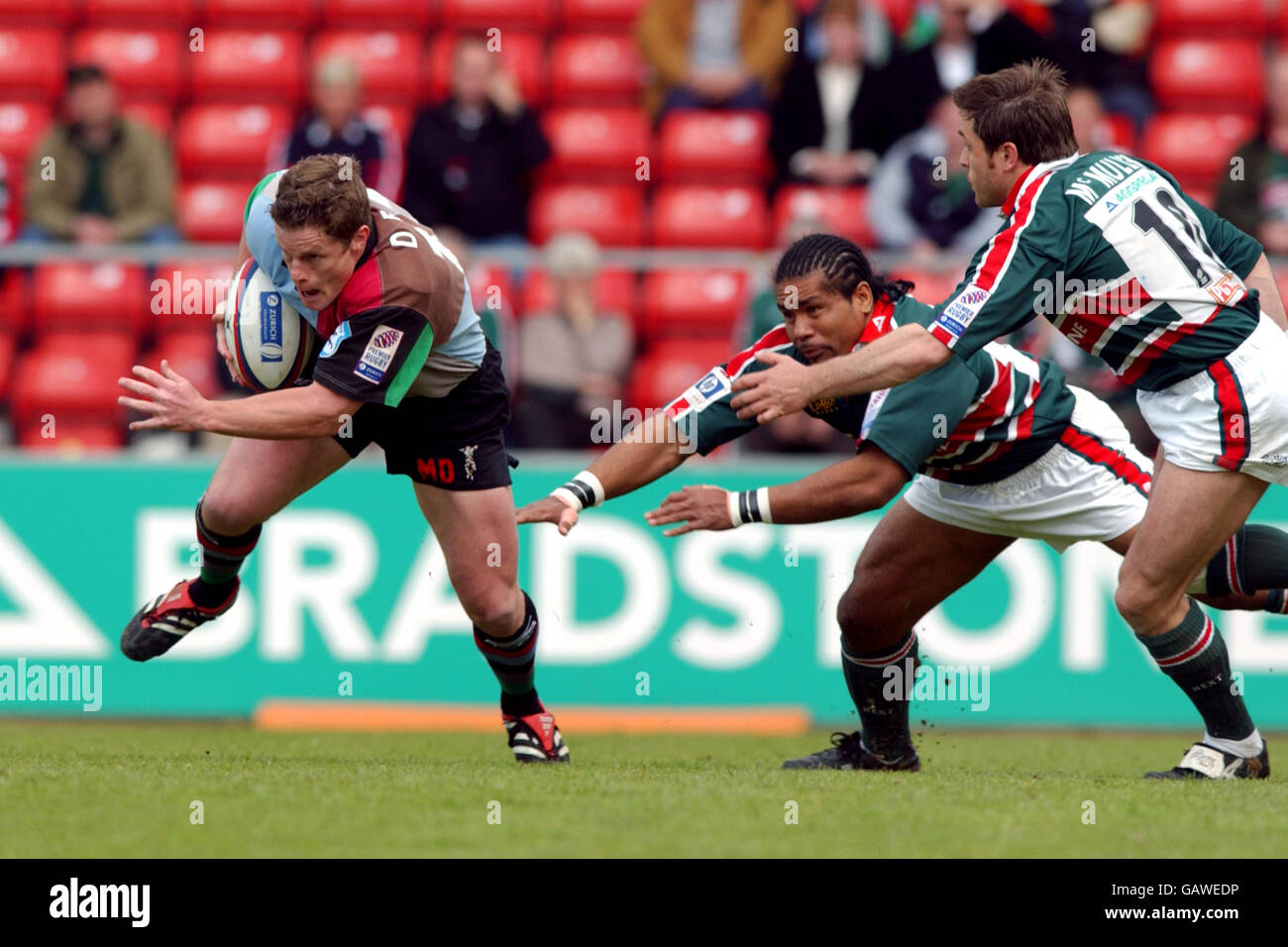 (L-R) NEC Harlequins' Mel Deane gets away from Leicester Tigers ...