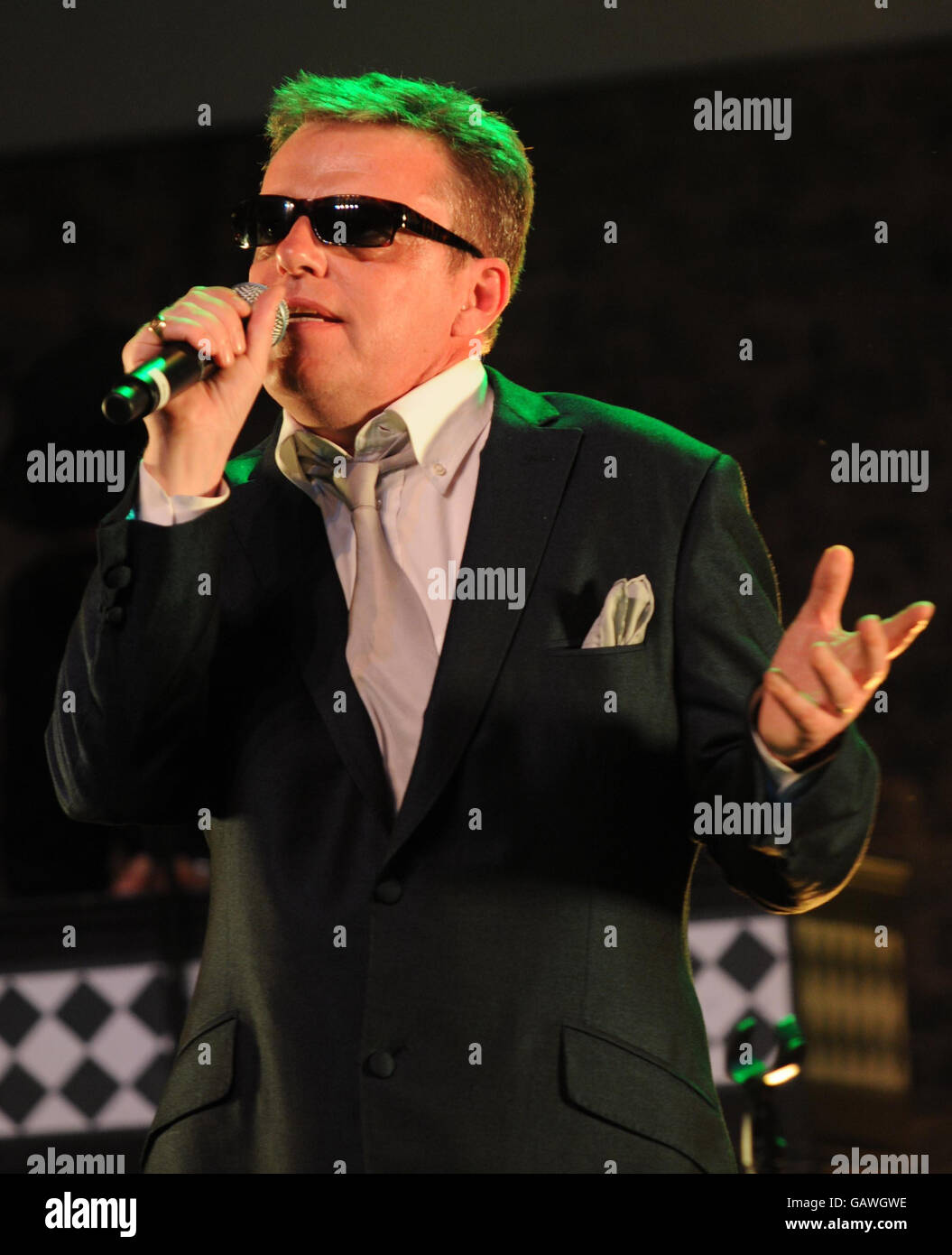 Suggs of Madness performs on stage with the band at the Hackney Empire ...