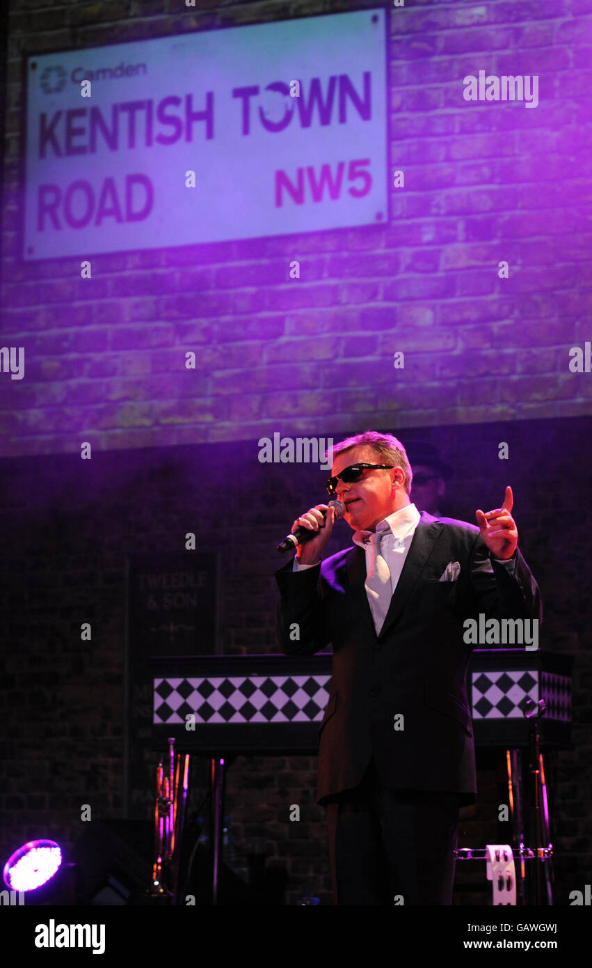 Suggs of Madness performs on stage with the band at the Hackney Empire ...