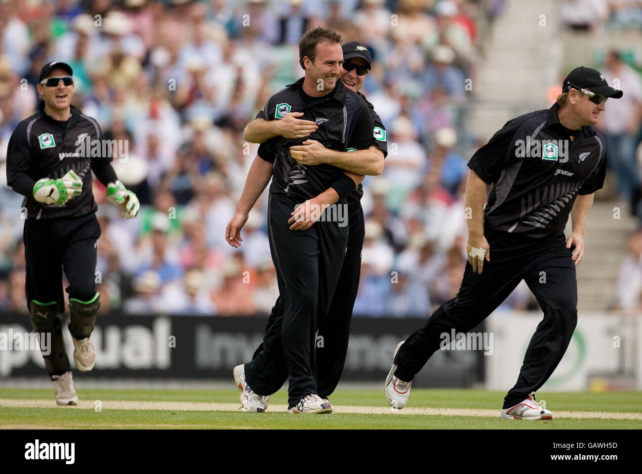 New Zealand's Mark Gillespie celebrates with Jamie How after dismissing ...