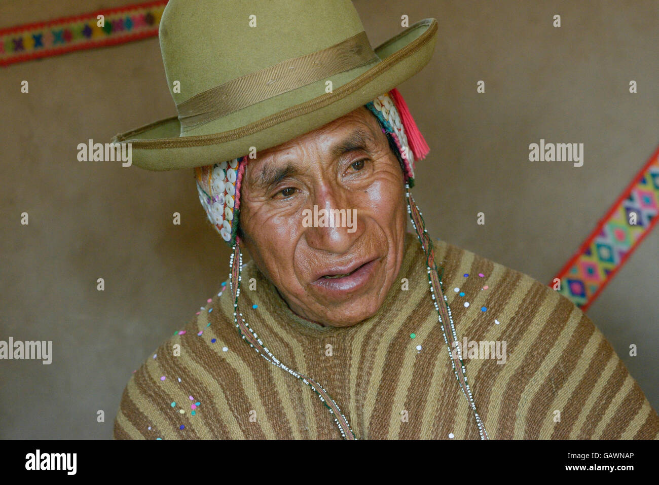 Portrait of a Native Peruvian man wearing typical andean robe, Paru ...