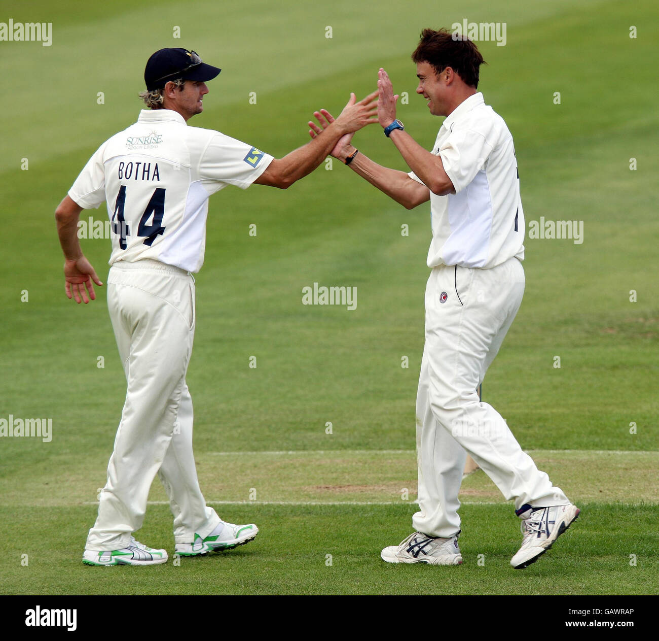 Warwickshire's Neil Carter (right) congratulates Ant Botha (left) after ...