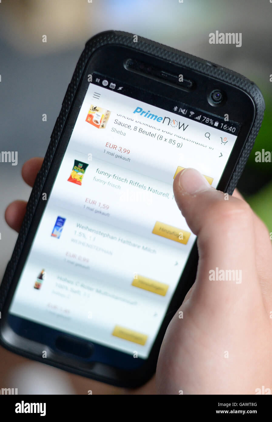 ILLUSTRATION - A man using the Amazon Prime Now app in Berlin, Germany ...