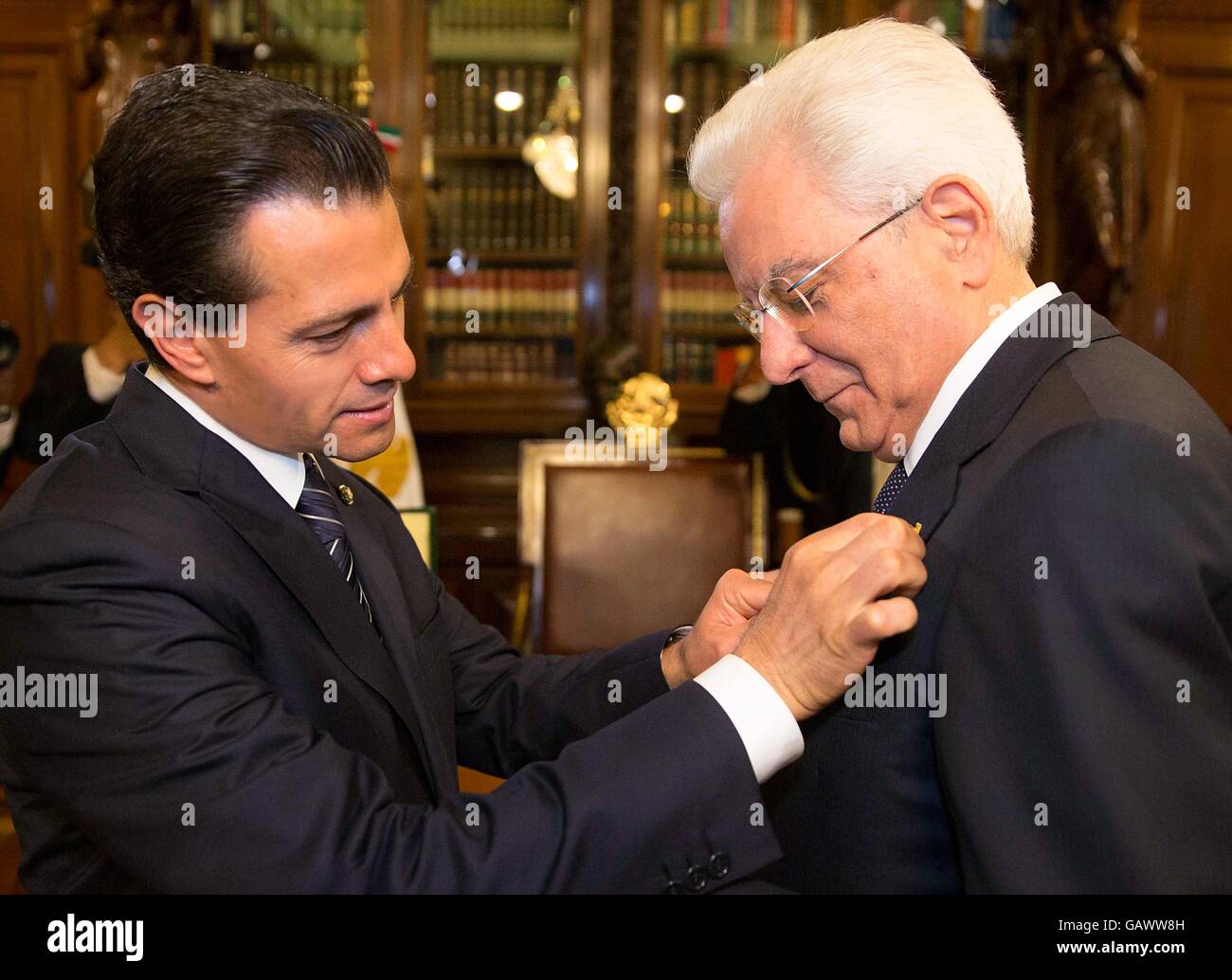 Mexican President Enrique Pena Nieto presents Italian President Sergio ...
