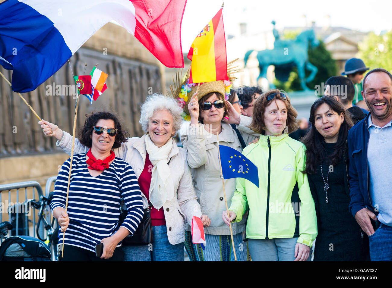 Brexit protest. A group of european people holding different EU flags ...