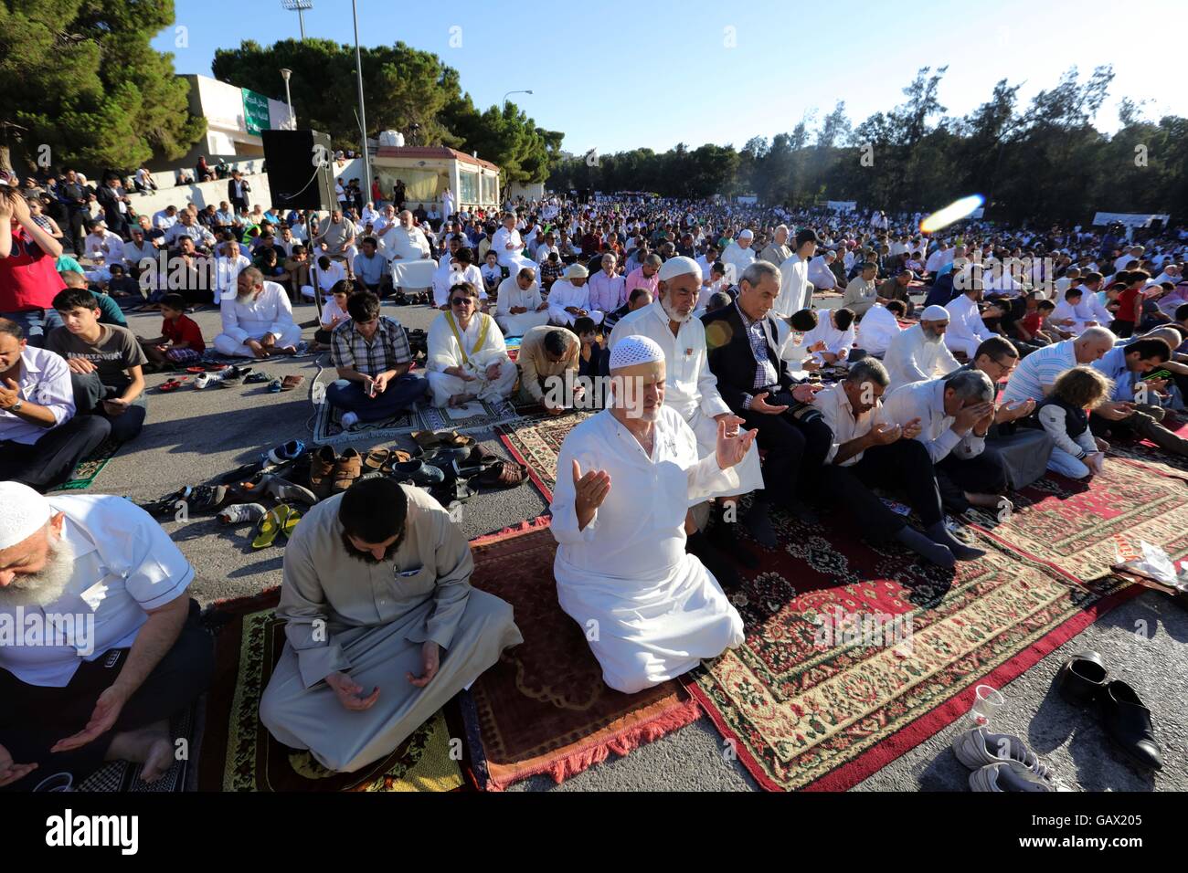 Amman. 6th July, 2016. Jordanian Muslims offer prayers during Eid al ...