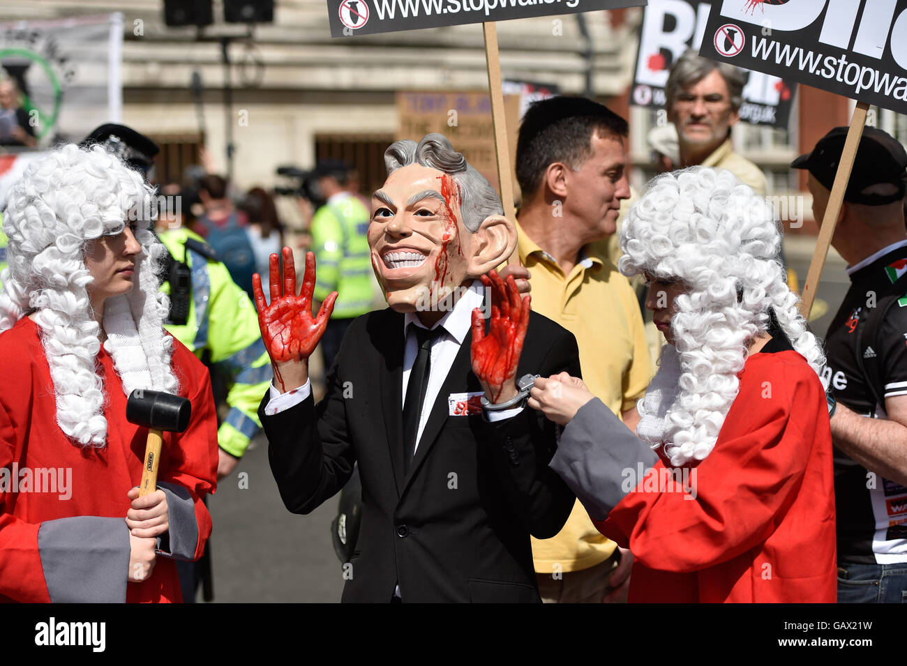 London, UK. 6th July, 2016. Protesters gather as Sir John Chilcott ...