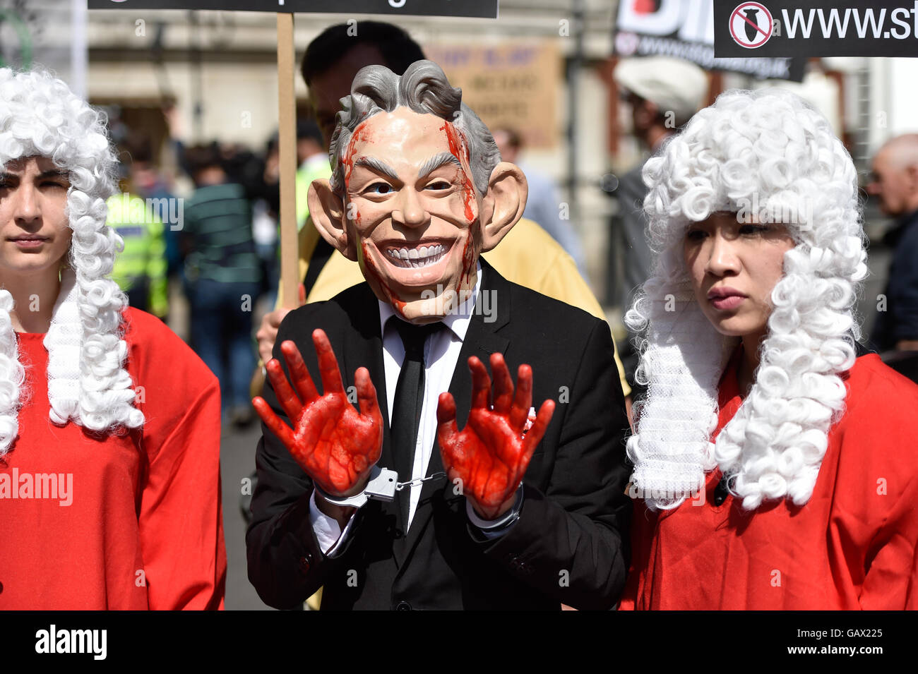 London, UK. 6th July, 2016. Protesters gather as Sir John Chilcott ...