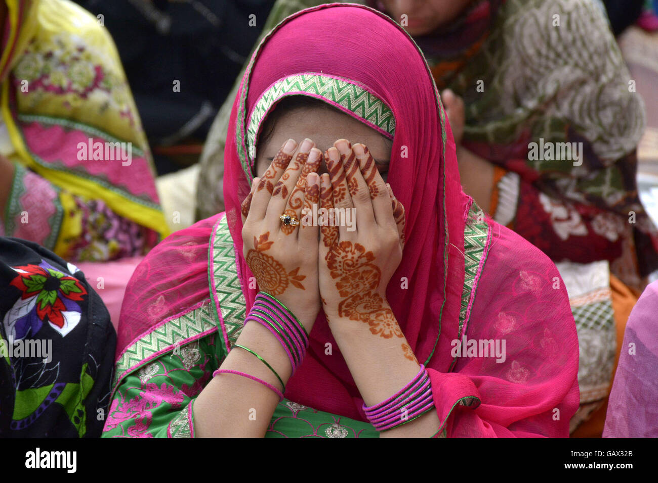Lahore. 6th July, 2016. A Pakistani Muslim woman offers Eid al-Fitr ...