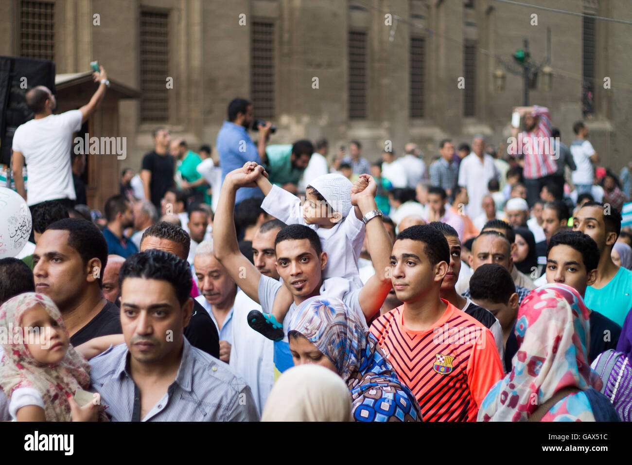 July 6, 2016 - Egypt - Father carrying his son on his shoulder after ...