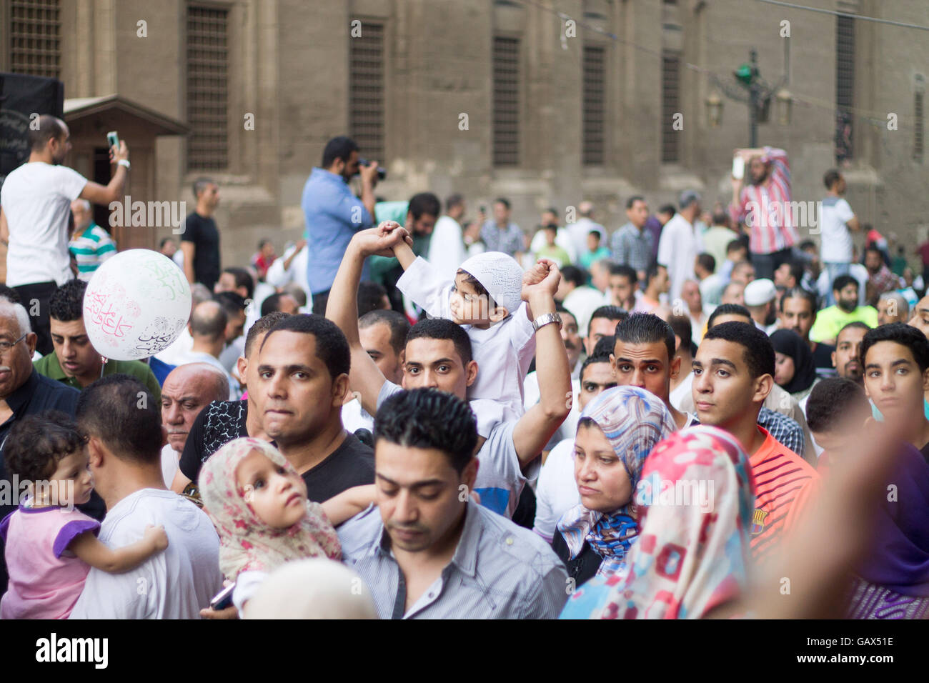 July 6, 2016 - Egypt - Father carrying his son on his shoulder after ...