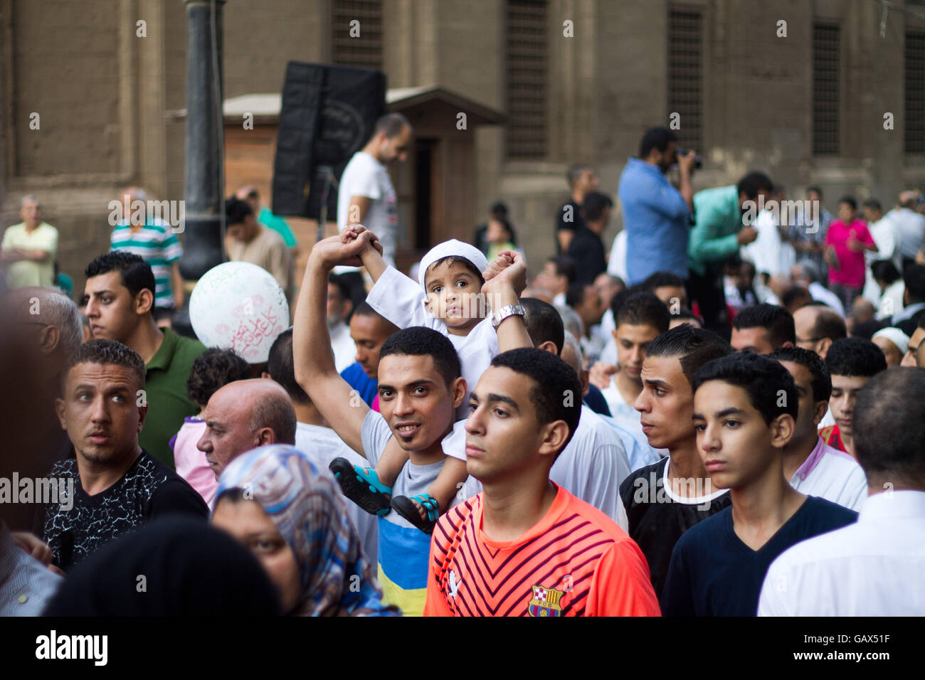 July 6, 2016 - Egypt - Father carrying his son on his shoulder after ...