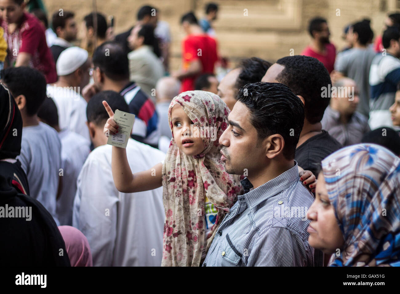 July 6, 2016 - Egypt - Father carrying his son on his shoulder after ...