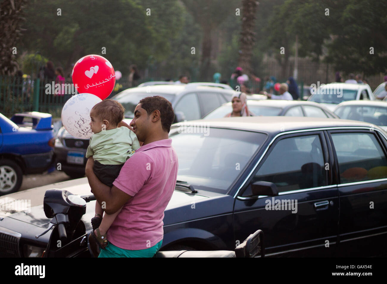 July 6, 2016 - Egypt - Father playing with his young son after the Eid ...
