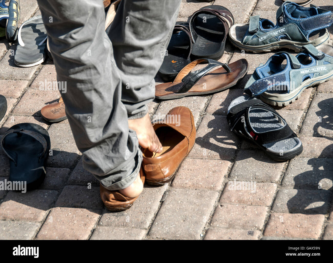 Takes off his shoes hi-res stock photography and images - Alamy