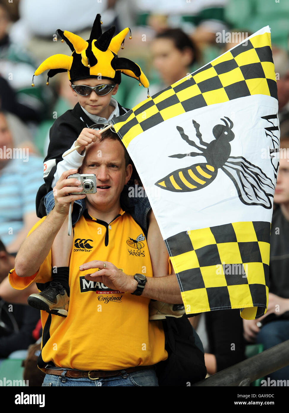 Two London Wasps fans show their support and colours in the stands ...