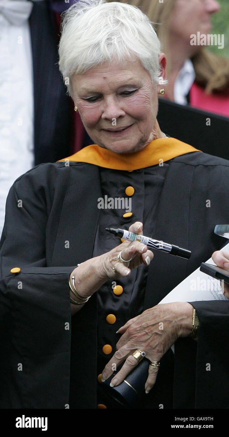 Actress Dame Judi Dench signs autographs after after being awarded an ...