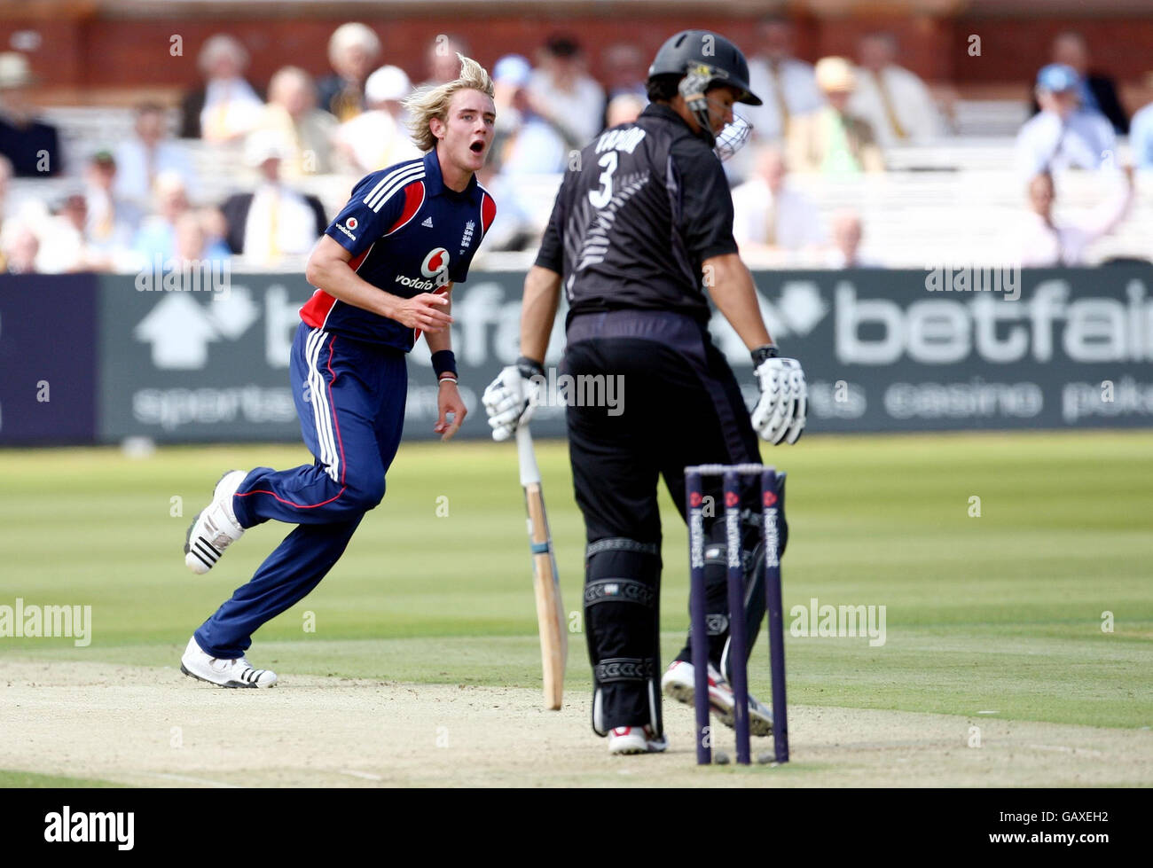 England's Stuart Broad celebrates taking the wicket of New Zealand's ...