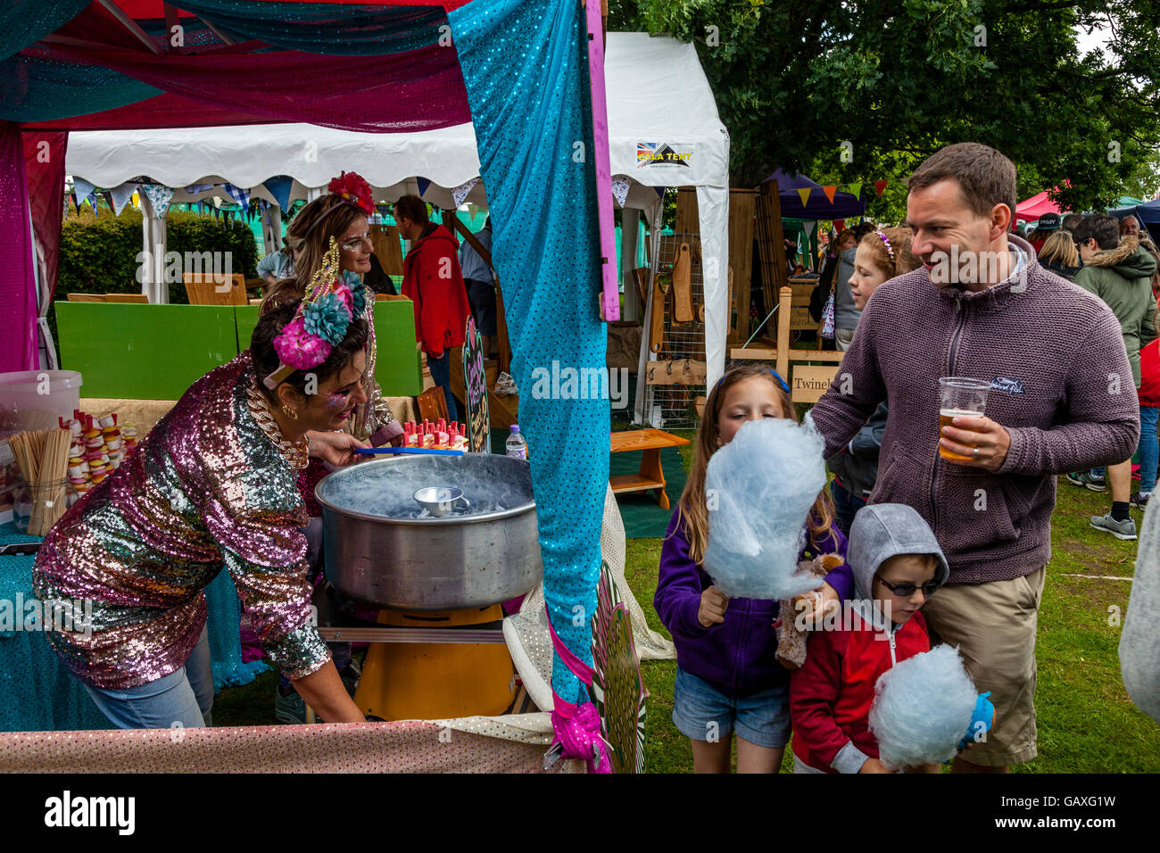 Young woman selling candy floss hi-res stock photography and images - Alamy