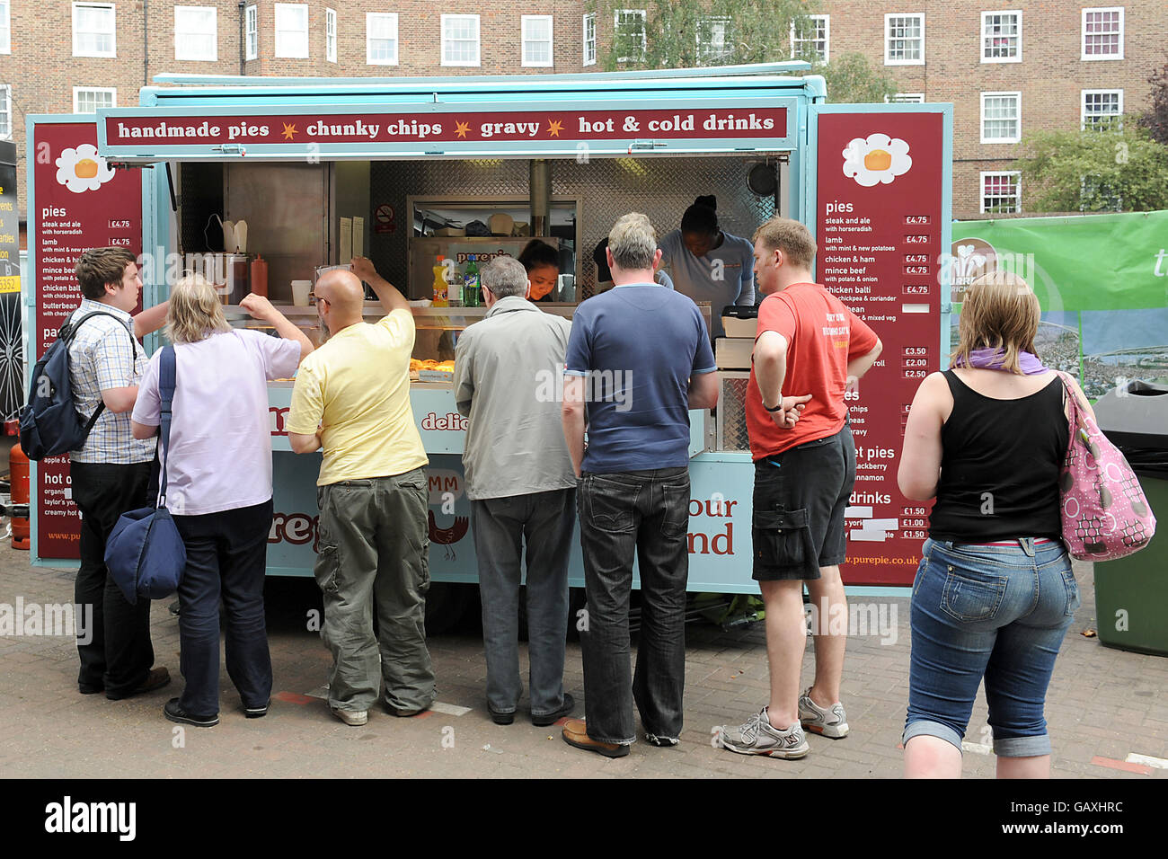 Fans queue at a catering van on the forecourt hi-res stock photography ...