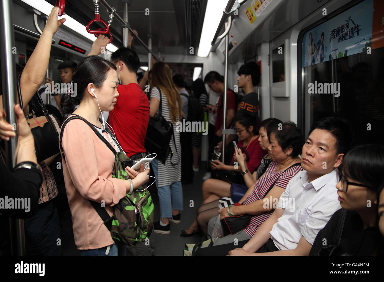 Asian people sitting in subway hi-res stock photography and images - Alamy