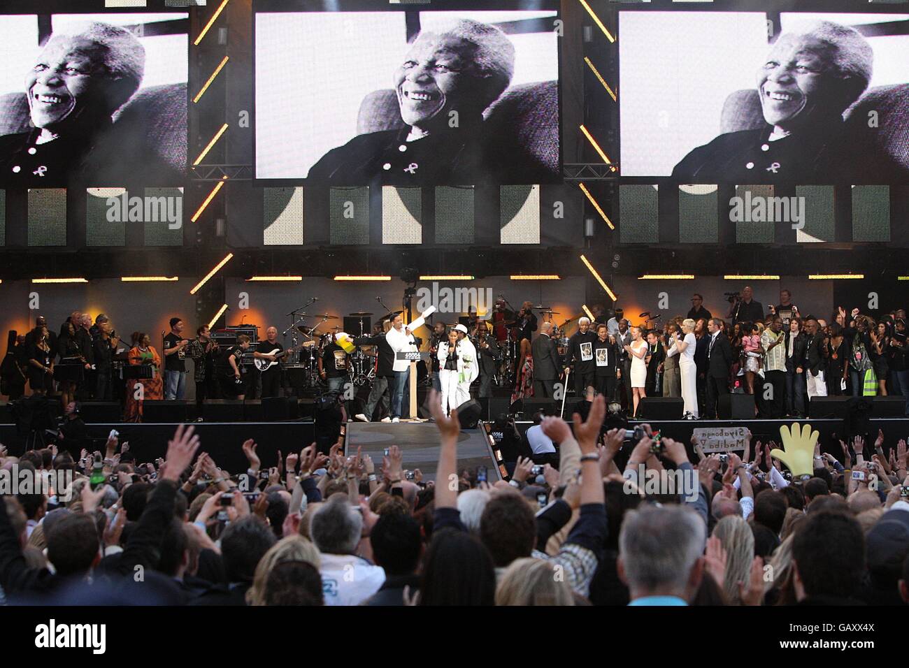 Nelson Mandela is joined on stage by his guests during the 46664 ...