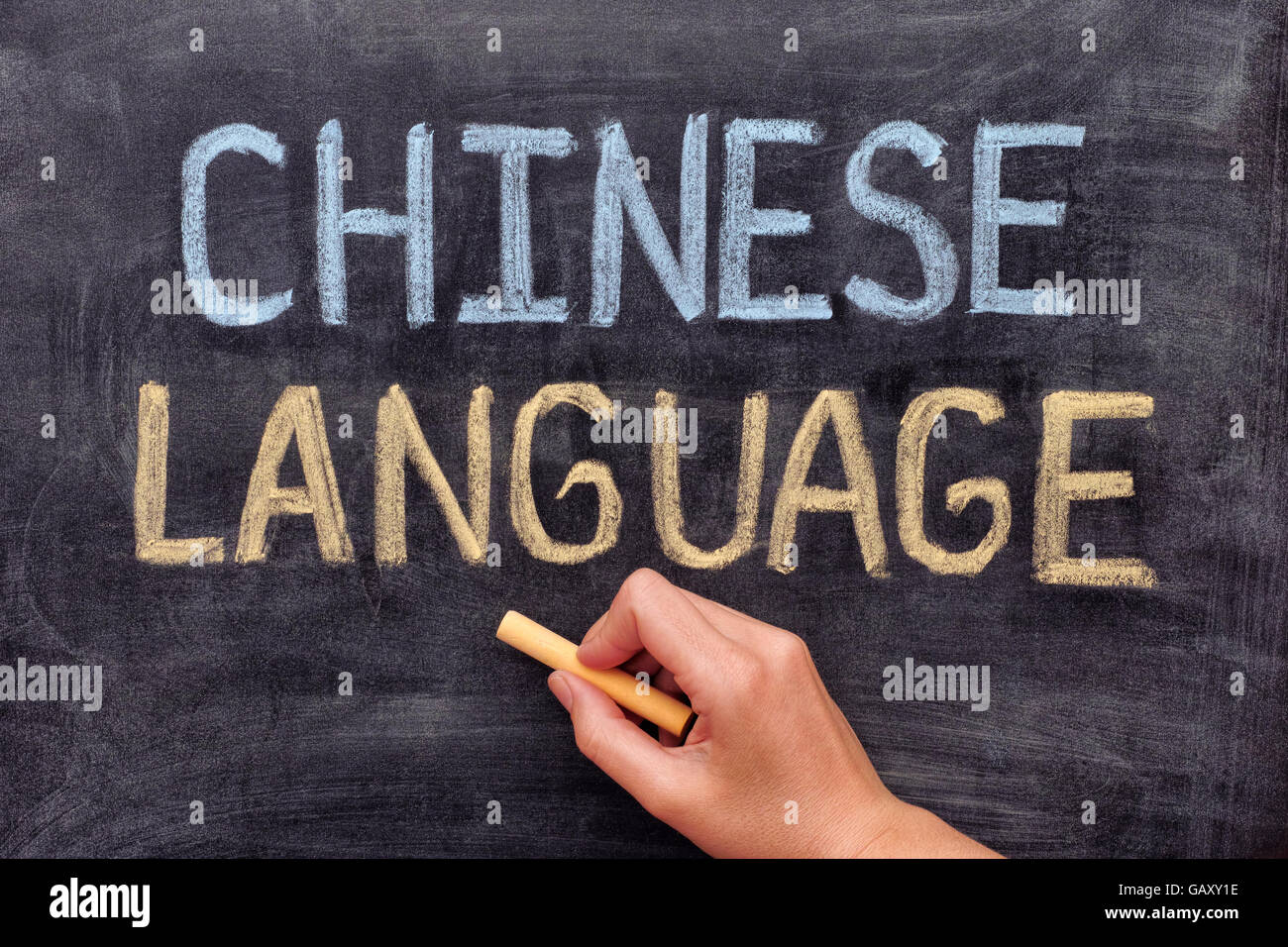 Chinese Language. Hand drawing Chinese Language on blackboard. Close up ...