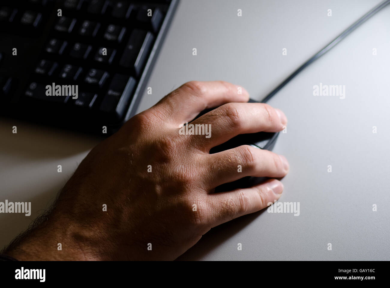 Detail of an office worker working at a computer workstation Stock ...